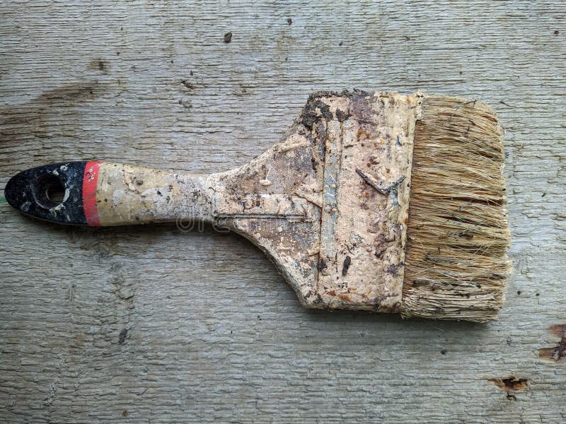 Old and Worn Construction Paint Brush is Covered in Paint. Stock Image ...