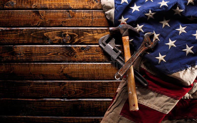 Old Work Tools on Large American Flag - Labor Day Background Stock ...
