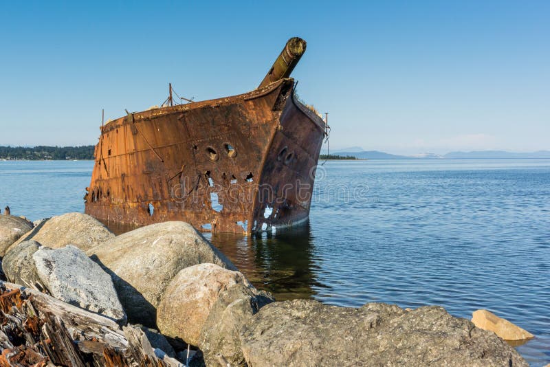 Old Wrecked Ship in the Water Rusting Away Stock Image - Image of blue ...