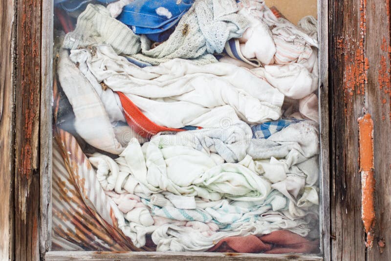 Old Wrinkled Clothes in the Window Stock Photo - Image of colorful ...
