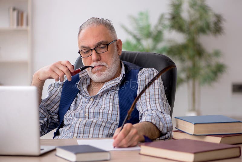 Old Male Writer Sitting at Workplace Stock Photo - Image of pile ...