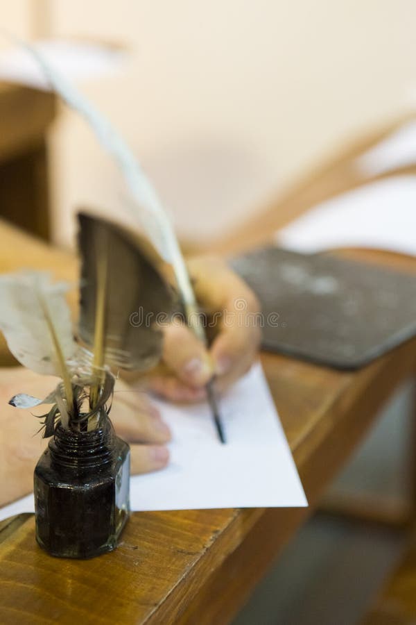 Writing with a Quill Pen and an Ink Bottle Stock Photo - Image of ...