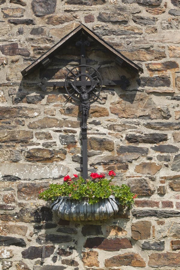 Handicraft Wrought Iron Cross Against Old Stone Facade of Farm in ...