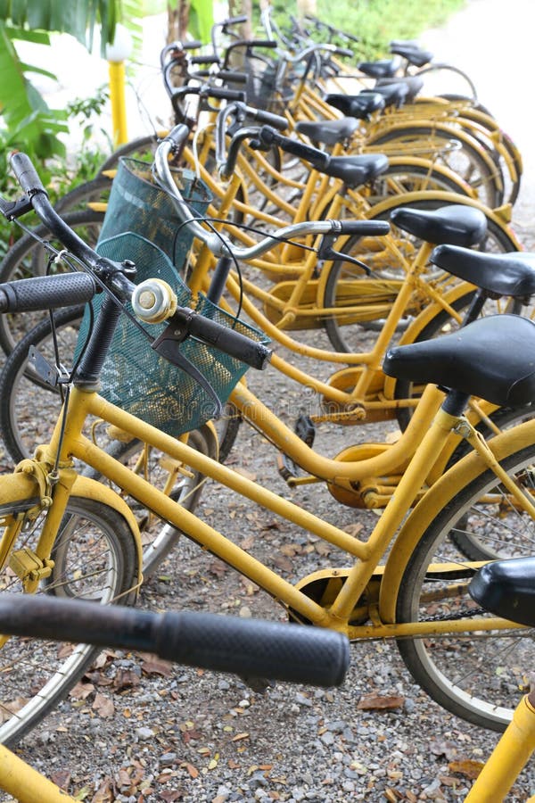 Old yellow bicycle parked. stock image. Image of yellow - 76736501