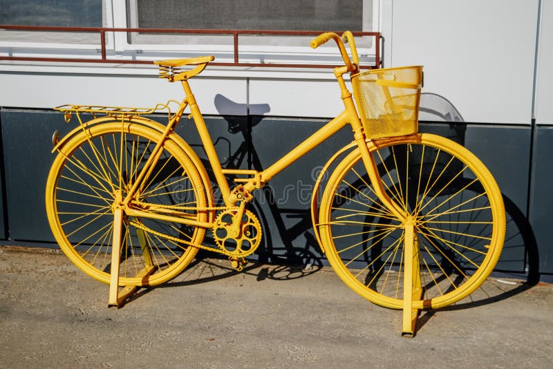 An Old Yellow Bicycle is Standing Near the Wall Stock Image - Image of ...