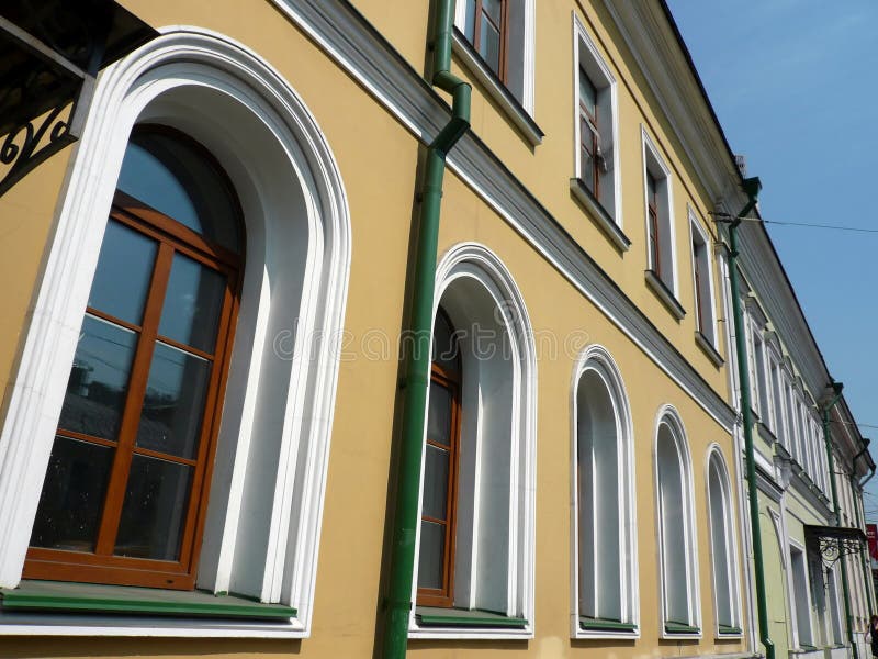 Old Yellow Building with Green Storm-down Pipe Stock Photo - Image of ...
