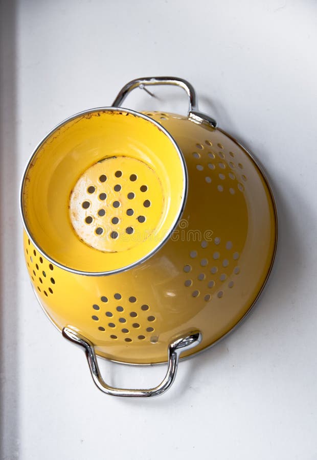 Old Yellow Colander Hanging on the Wall Stock Photo - Image of yellow ...