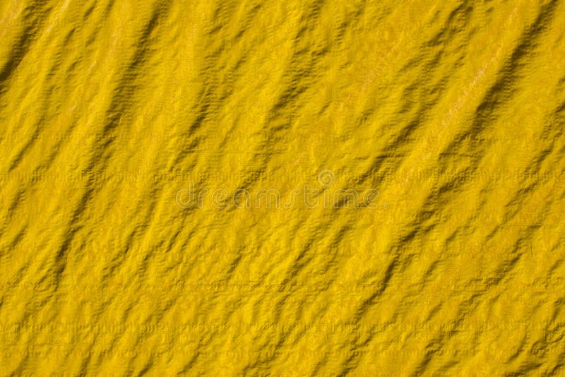 Old Yellow Crumpled Canvas with Folds and Shadows. Rough Surface ...