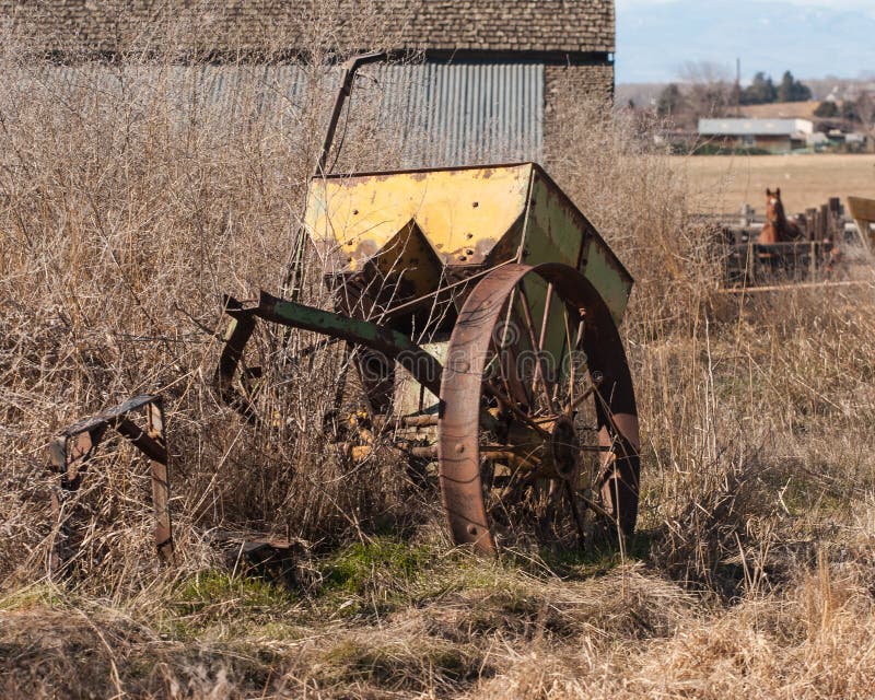 Old yellow farm equipment stock photo. Image of farm - 56654472