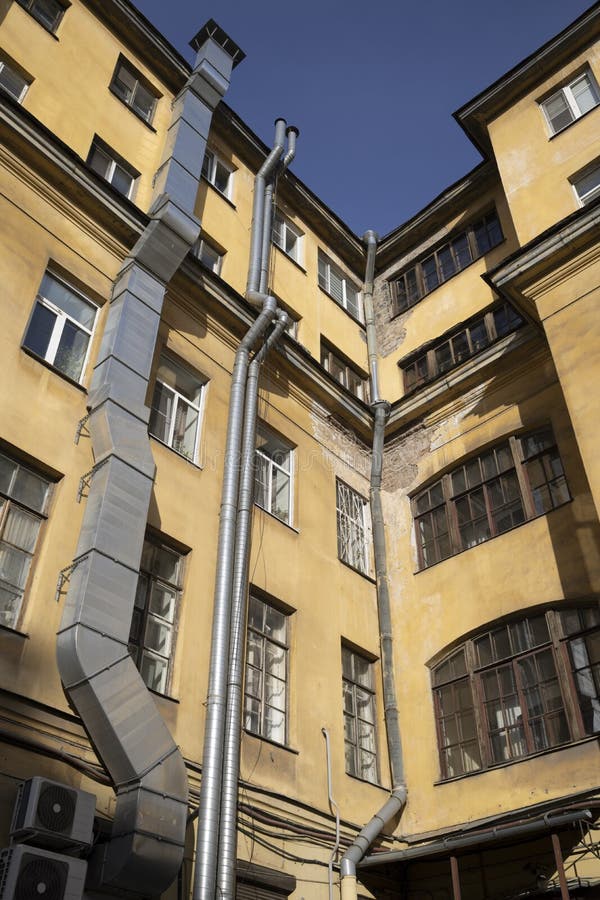 Old Yellow House with Ventilation and Chimney Systems Stock Photo ...