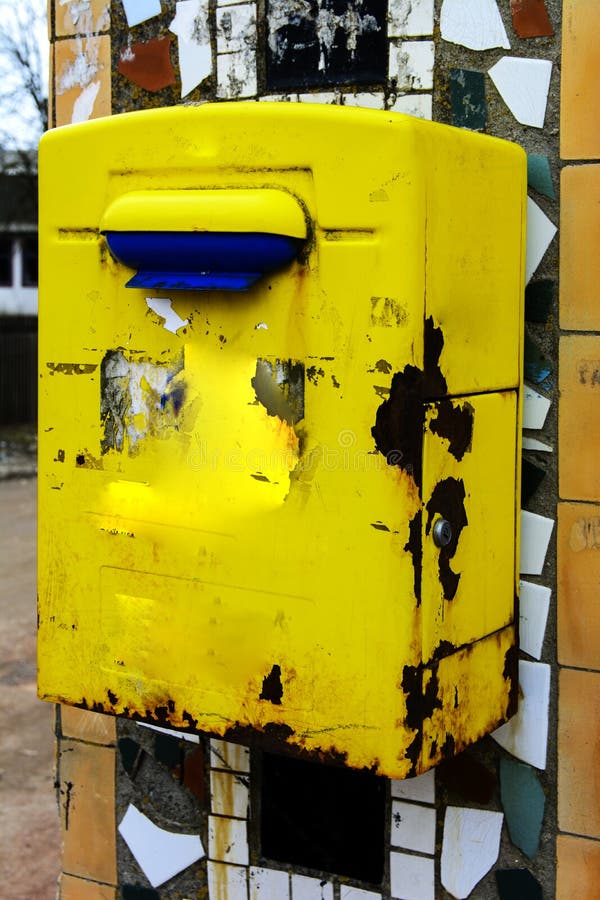 Old Yellow Mailbox Hanging on the Brick Wall of a House Stock Image ...