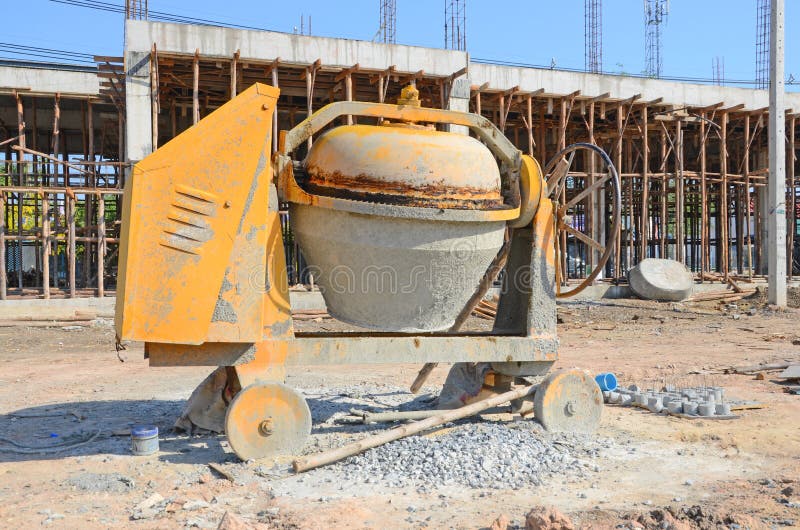 Yellow Mortar Mixer in Front of Construction Site Stock Photo - Image ...