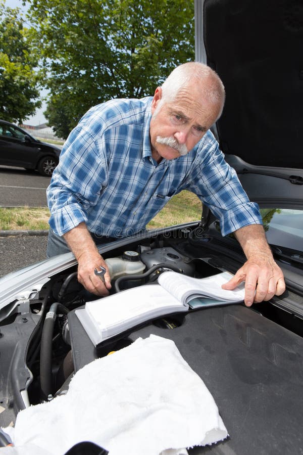 Older Man Checking Levels and Servicing Car Stock Photo - Image of ...