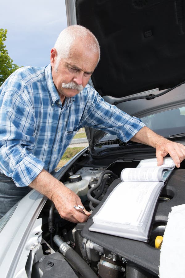 Older Man Checking Levels and Servicing Car Stock Photo - Image of ...
