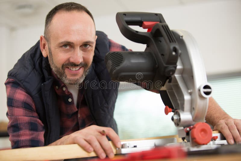 Older Man Cutting Wood with Circular Saw Stock Image - Image of looking ...
