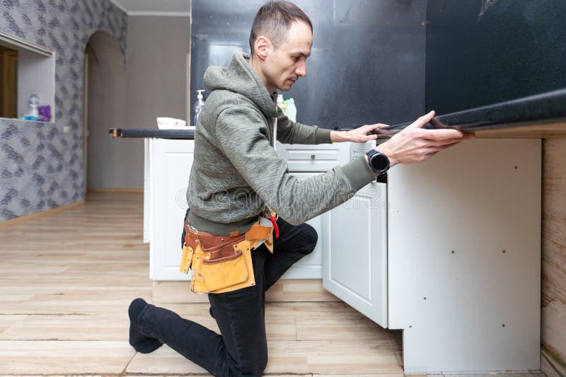 Older Man Disassembling Apartment Kitchen Out of Service Stock Photo ...