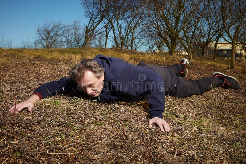Man Running in Park Get Down by Heart Attack Stock Image - Image of ...