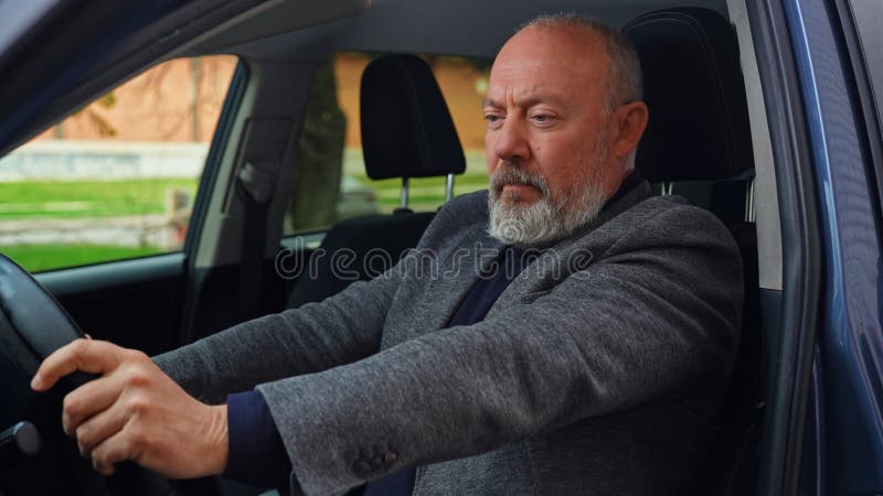 Elderly Man Driving a Car with Calm Expression Stock Image - Image of ...
