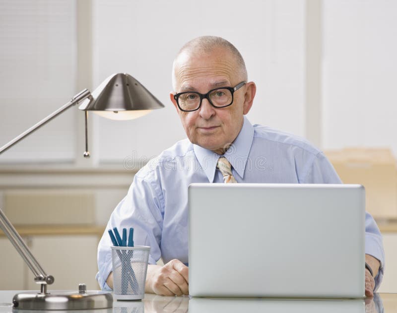 Older man on laptop. stock image. Image of clothing, businessman - 10011767