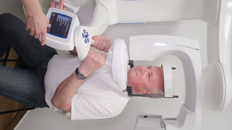 Dental X-ray Machine with a Cephalometric Socket, an Elderly Man Takes ...