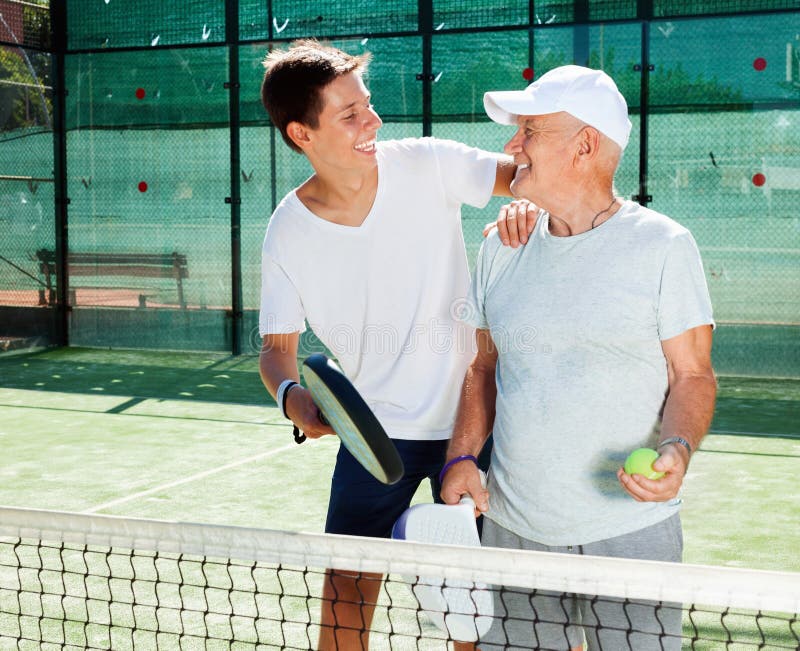 Older Man and a Young Man Talking on Court Playing Paddle Stock Image ...