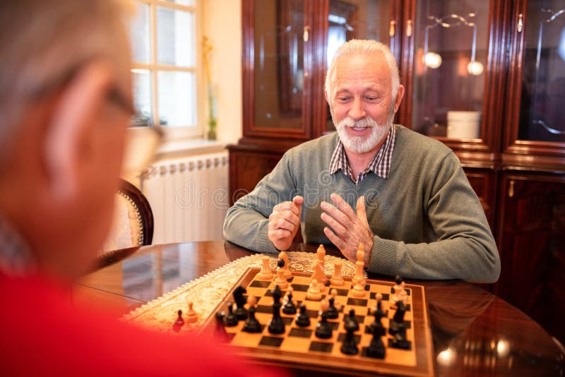 Older Men Playing a Game of Chess Stock Photo - Image of background ...
