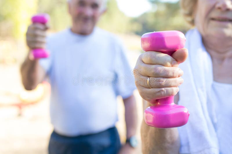 Older people doing sport stock photo. Image of dumbbells - 141774048