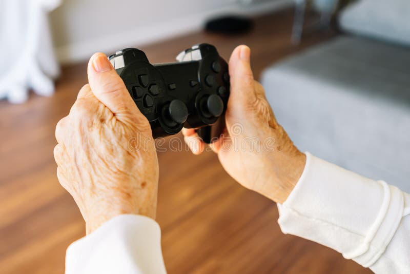 Older Person S Hands Using a Video Game Controller Stock Photo - Image ...