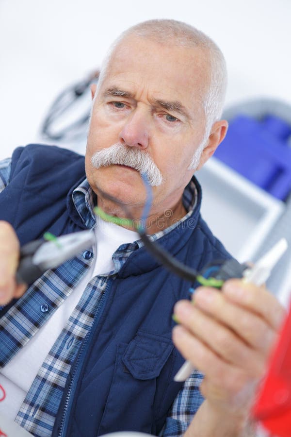 Older Technician or Repair Man Stock Image - Image of hard, repair ...