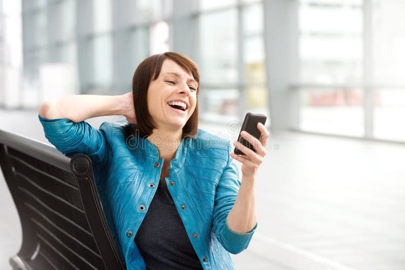 Older Woman Reading Text Message and Laughing Stock Image - Image of ...