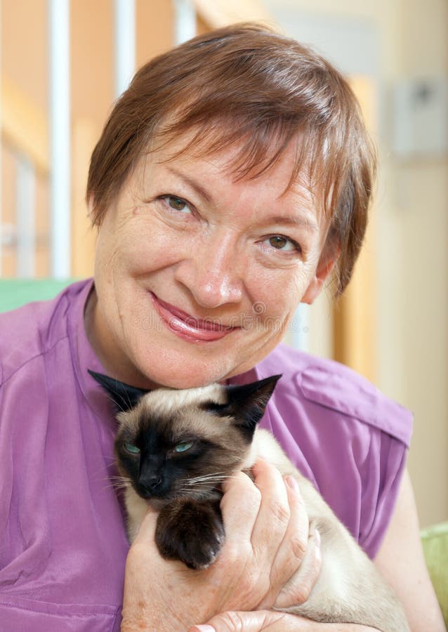 Older Woman with Siamese Kitten Stock Photo - Image of woman, care ...