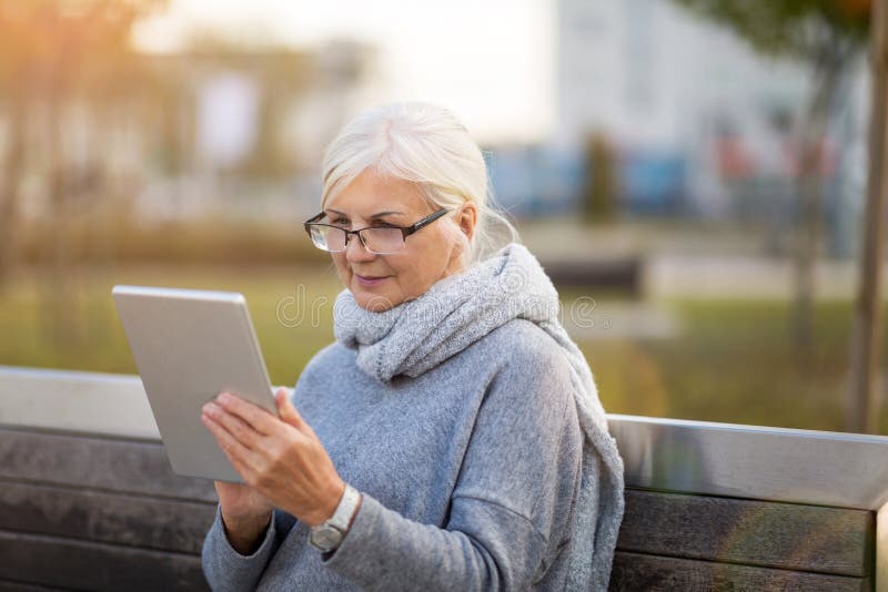 Older Woman Using Digital Tablet Stock Image - Image of enjoying ...