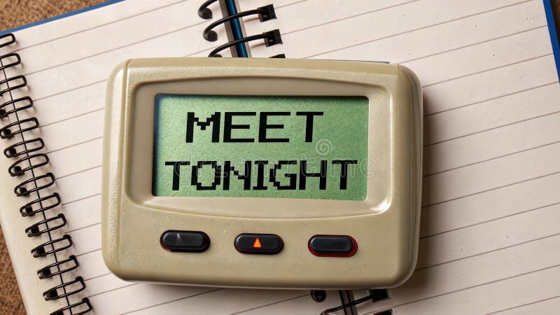 OldSchool Communication an Offwhite Pager Resting on an Open Notebook ...