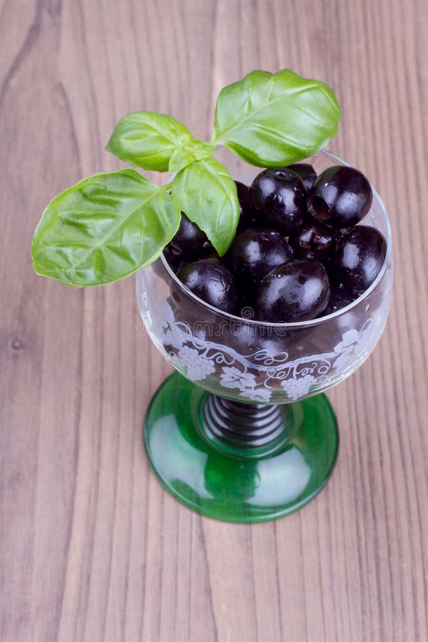 Olive with Basil in a Glass Stock Image - Image of wooden, greek: 30351461
