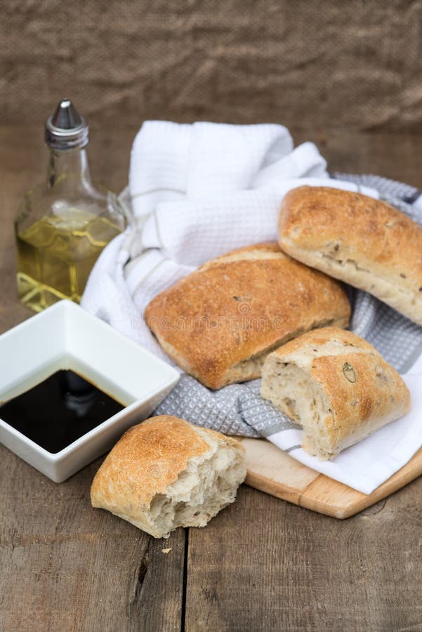 Panini Rolls in Rustic Kitchen Setting with Cooking Utensils Stock ...