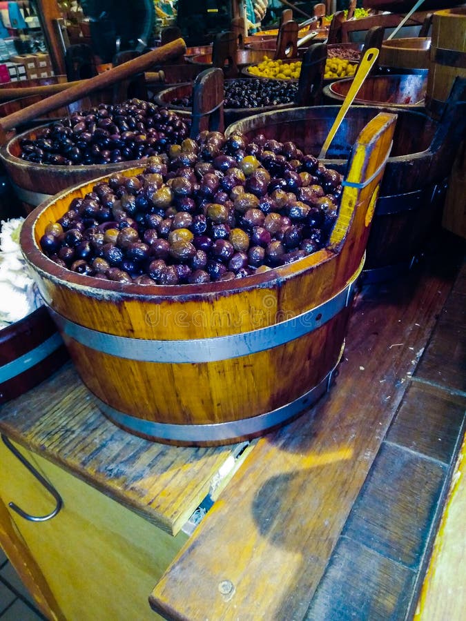 Olive Display in Rustic Barrels with Spoons Stock Image - Image of ...