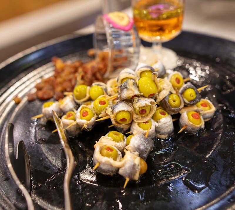 Olives with Fish on Wooden Skewers Stock Image - Image of plate, olive ...