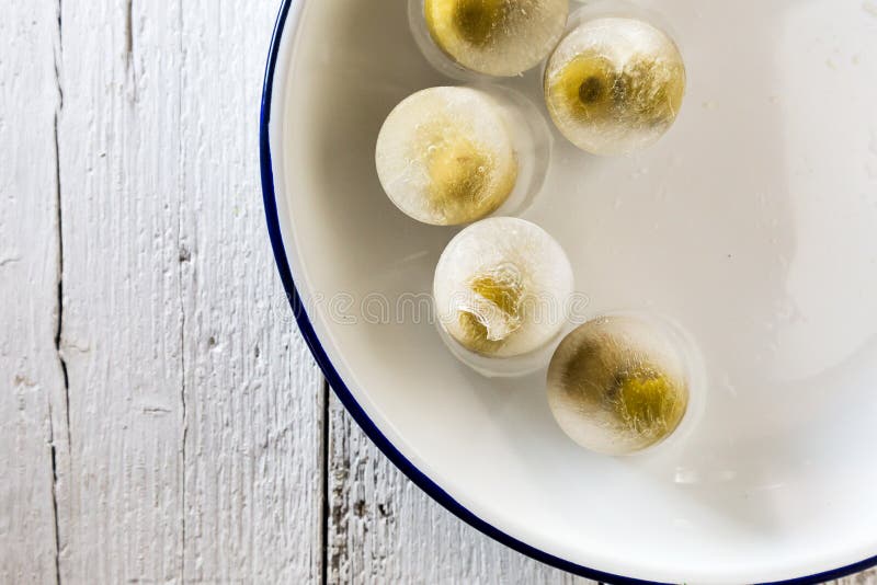 Olives Stuffed Inside an Ice Cube Stock Image - Image of mood, drink ...