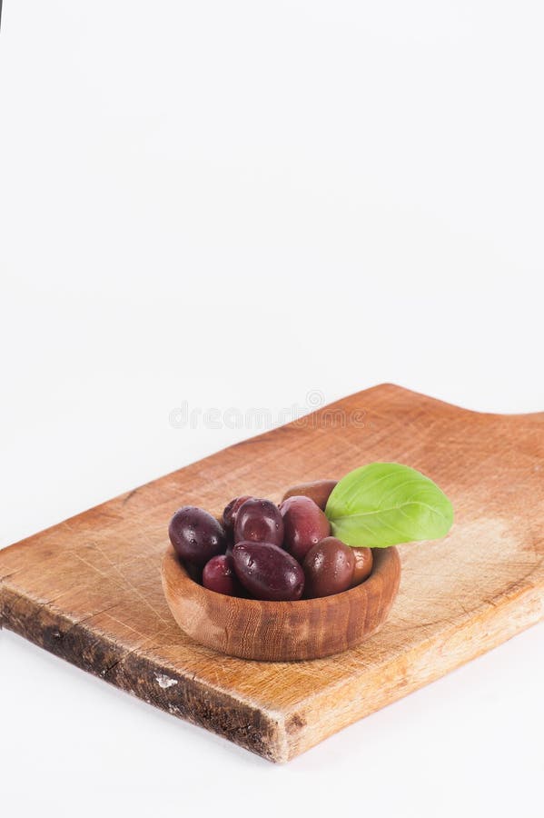 Olives in a Wooden Plate and a Rough Board Isolated Stock Photo - Image ...