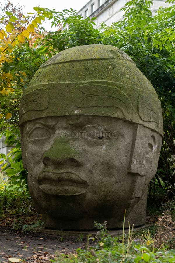 Olmec head in the green editorial stock photo. Image of mysterious ...