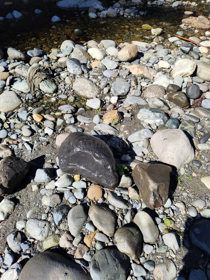 Colorful river rocks stock image. Image of areas, litt - 229959639