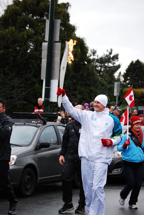 Olympic Torch Bearer editorial photo. Image of celebration - 13297616