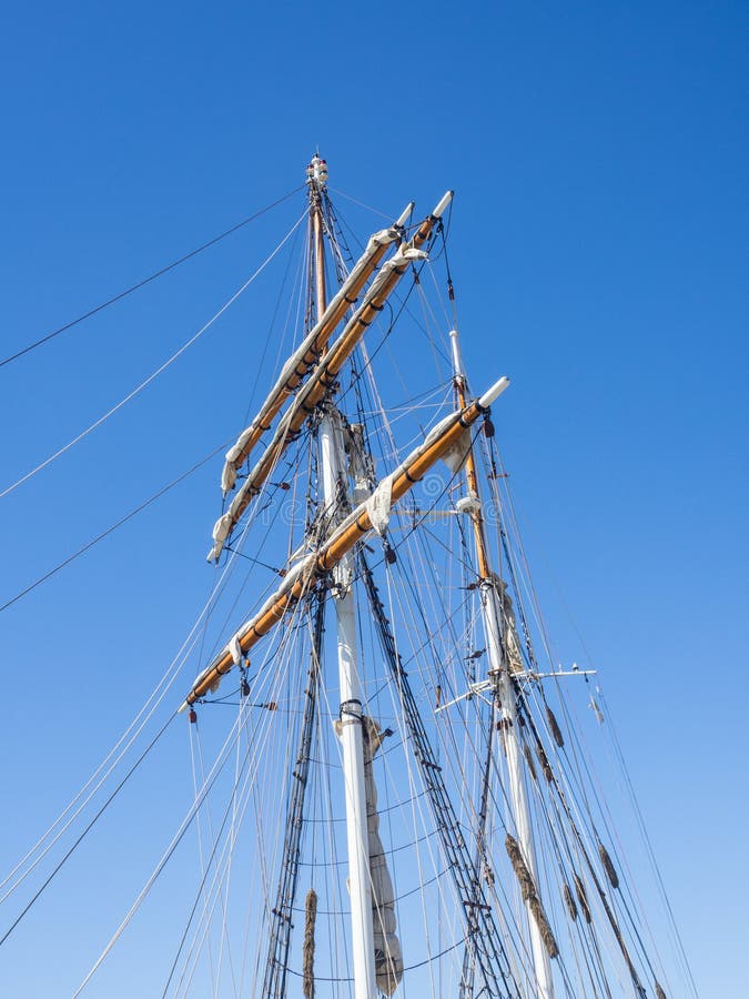 A Wooden Sailing Ship Pole Isolated on Blue Sky Background. Stock Photo ...