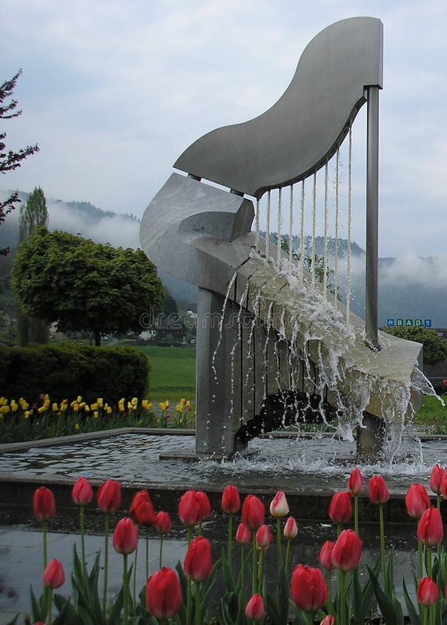 The Amazing Harp Fountain with Water Strings Surrounded by Beautiful ...