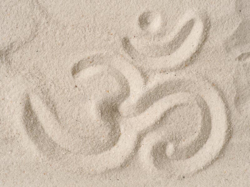 Om symbol in sand stock image. Image of written, design - 95370553