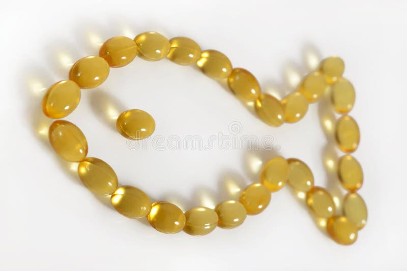 Omega-3 Fish Fat Oil Capsules Shaped in Fish on a White Stock Image ...