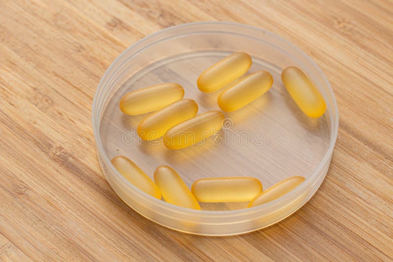 Omega 3 Gel Yellow Capsules on the Wooden Table Stock Image - Image of ...