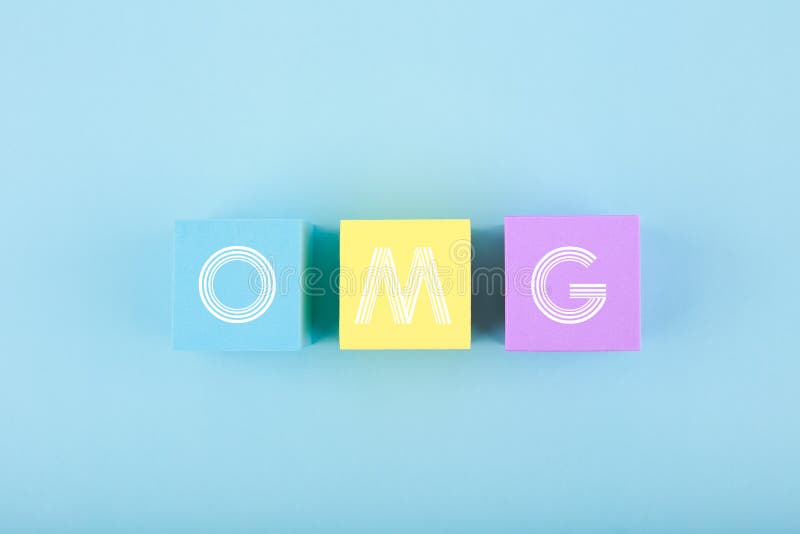 OMG Letters Written on Multicolored Cubes on Bright Blue Background ...