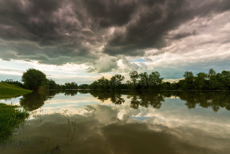 Ominous Stormy Sky Reflection Over Natural Lake Stock Image - Image of ...