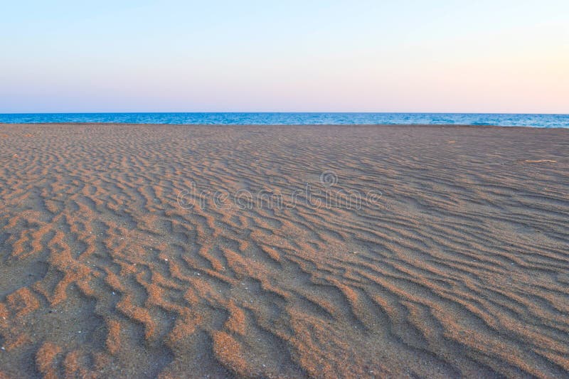 Onaangeroerd Zand Op Het Strand Stock Afbeelding - Image of griekenland ...
